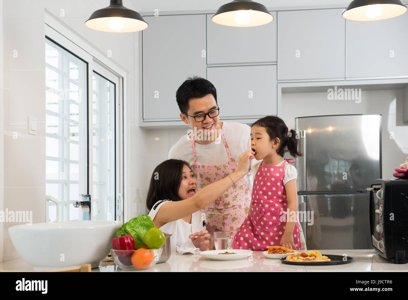asian family cooking at kitchen Stock Photo - Alamy