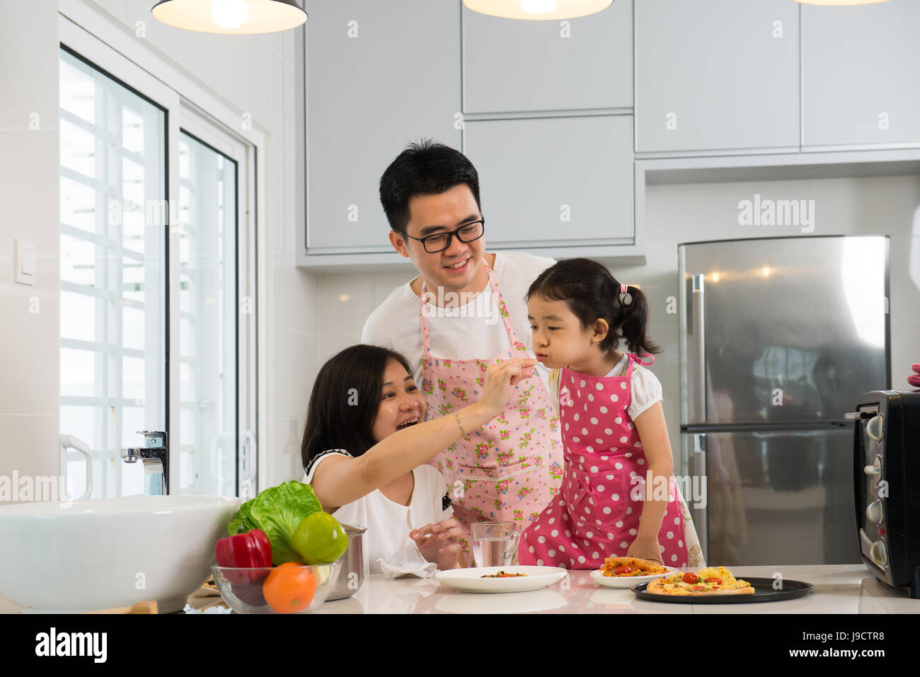 asian family cooking at kitchen Stock Photo - Alamy