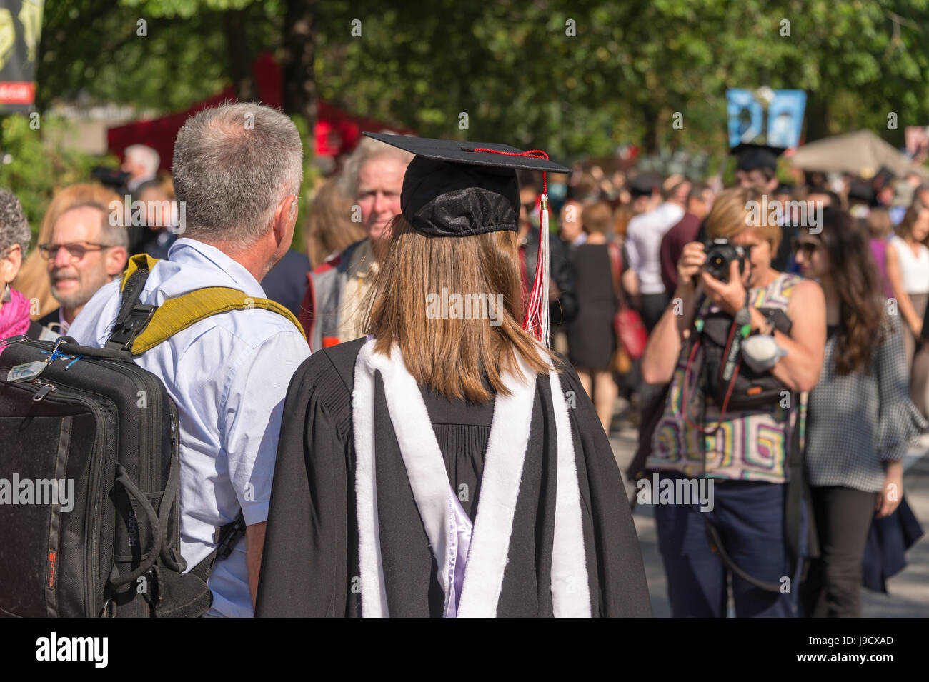 Graduates black gown hi-res stock photography and images - Alamy