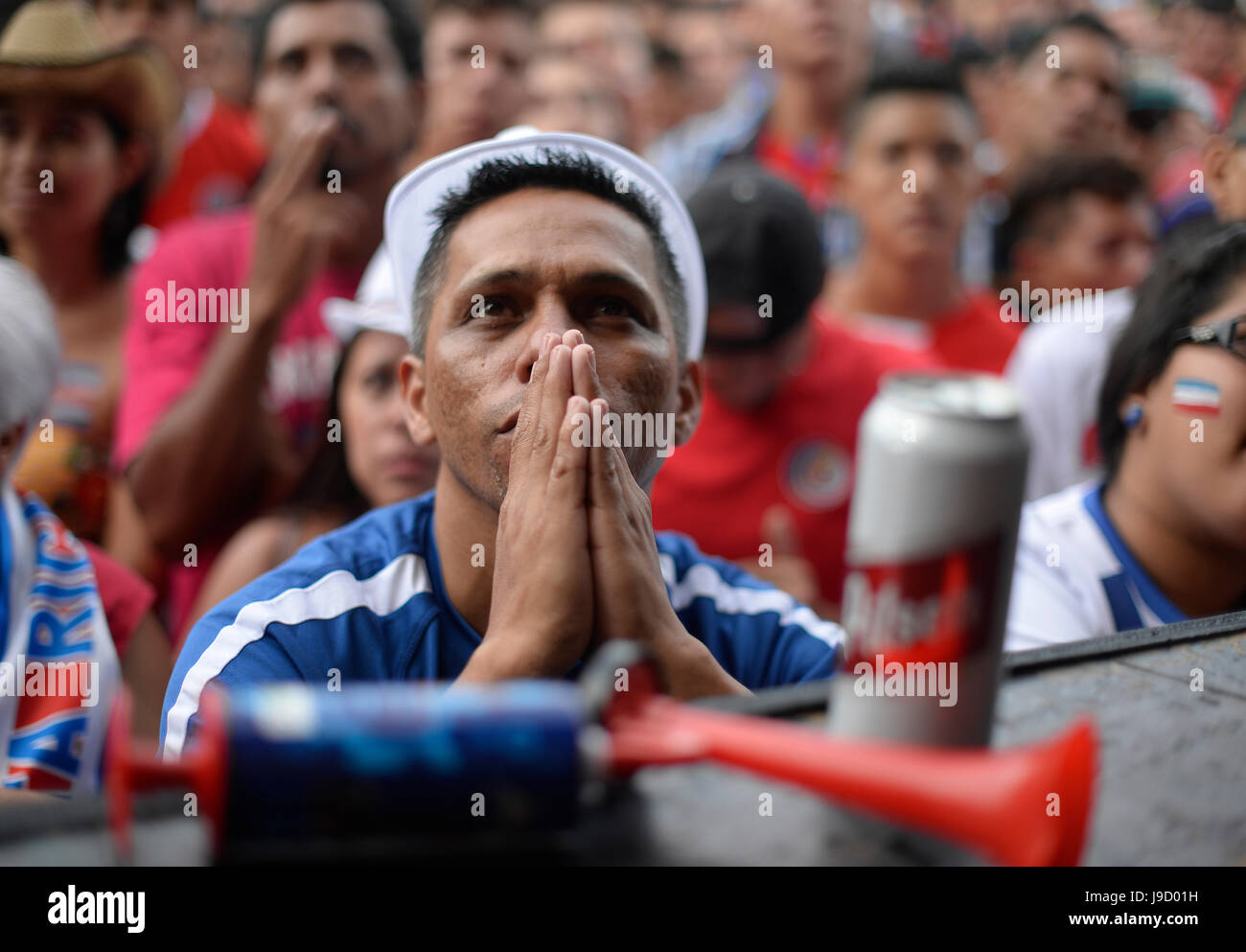 A Costa Rica fan watches from the Plaza de La Democracía in San José as ...