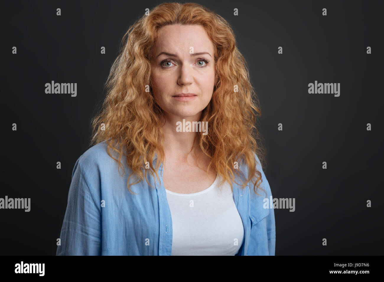 Expression of sorrow. Serious artistic stunning lady making an ...