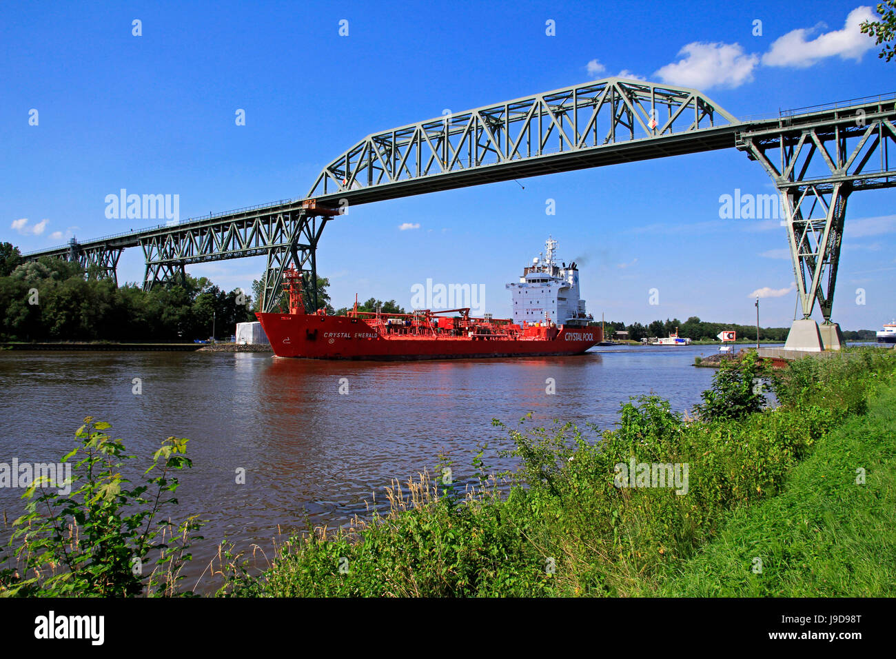 Ship on Kiel Canal going under the Railway Bridge of Hochdonn ...