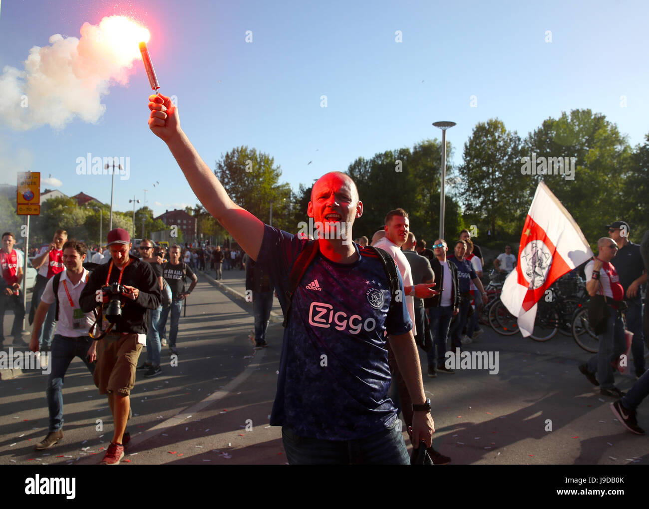 Ajax fans holding flares outside the stadium prior to the match Stock ...