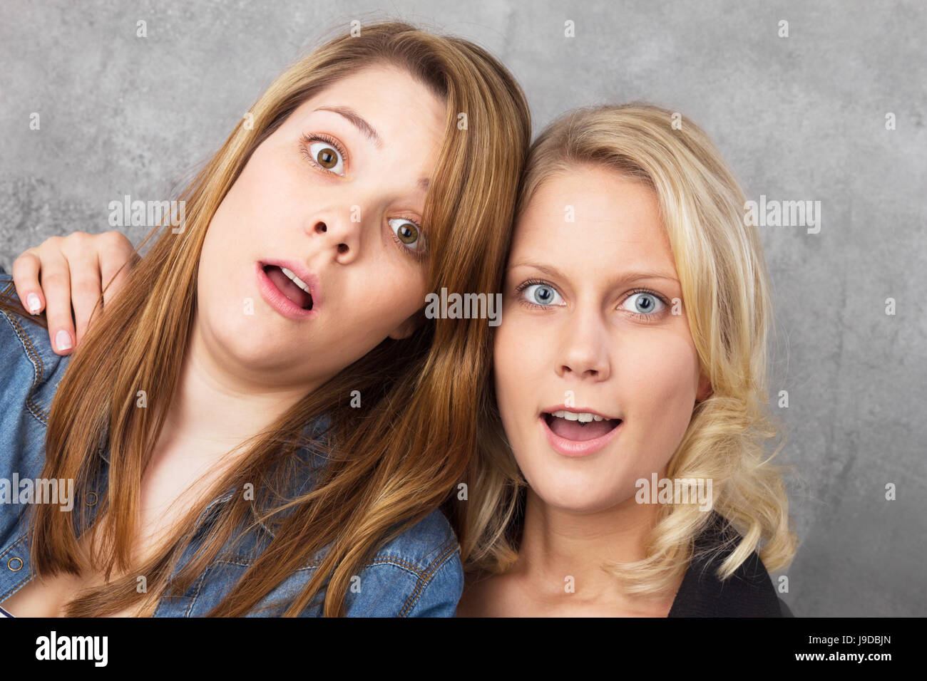Two surprised beautiful women open hi-res stock photography and images ...