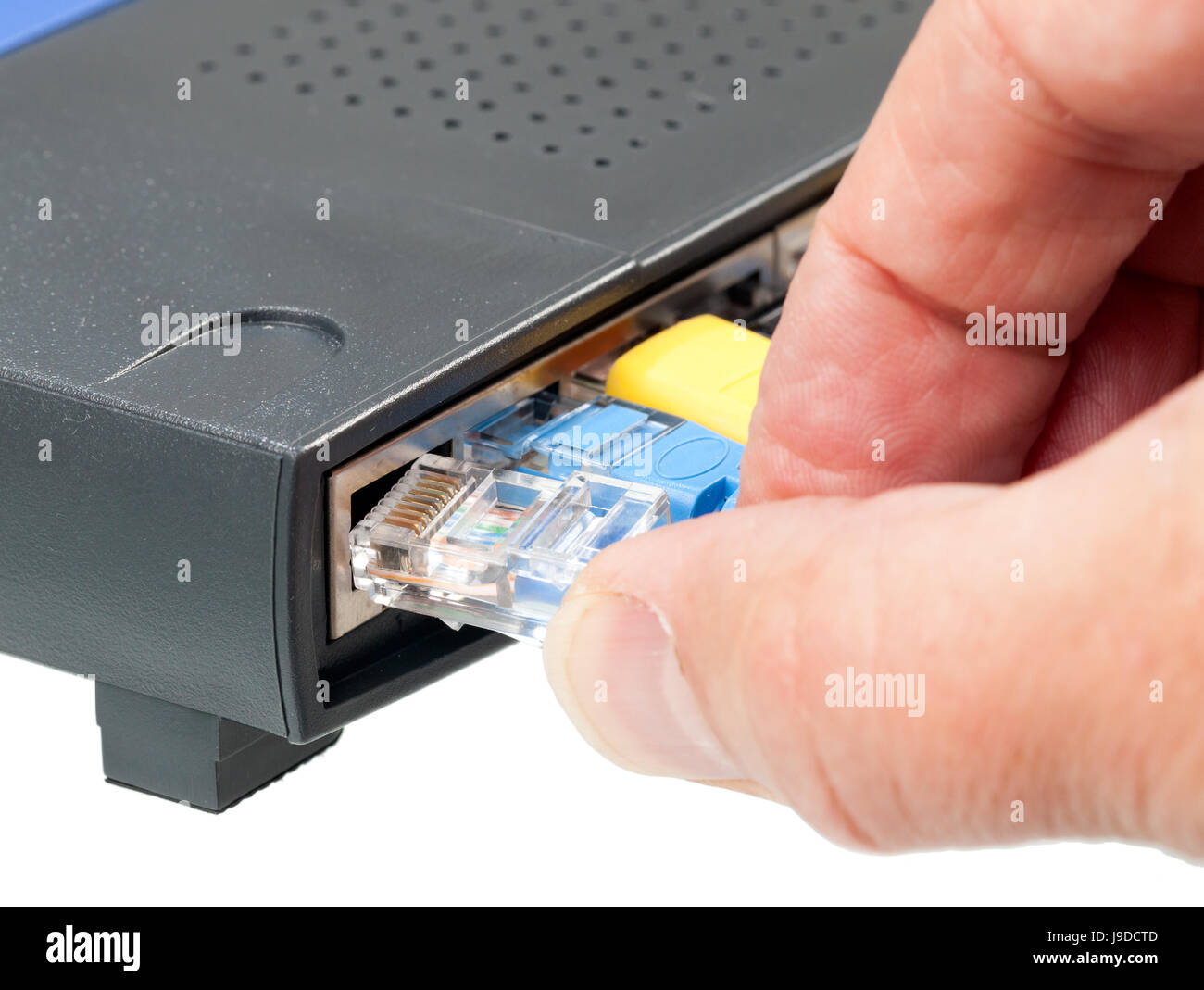 Black hand plugs ethernet cable router hi-res stock photography and ...