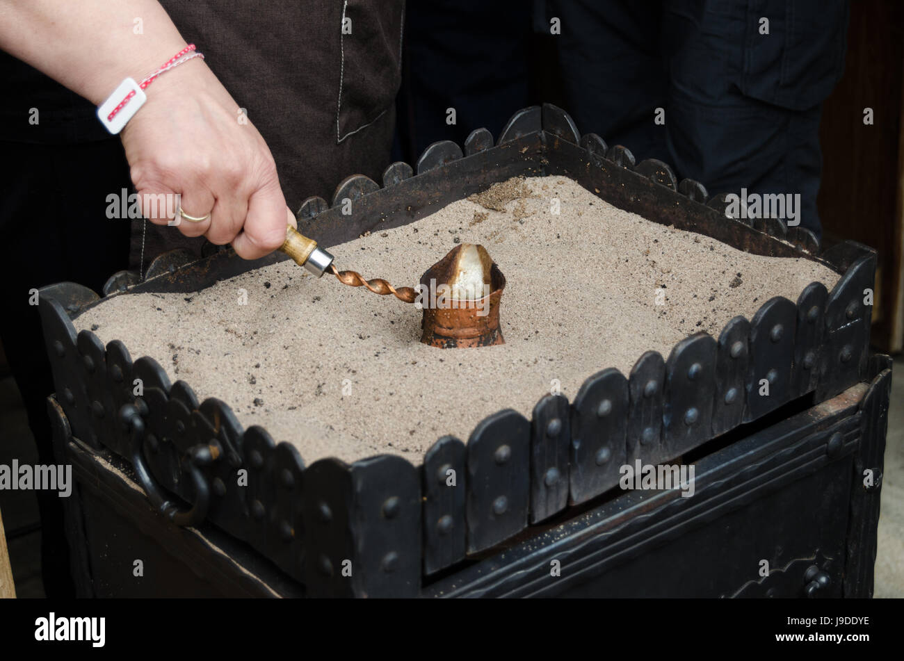 Close up view of turkish coffee prepared on hot golden sand. Coffee ...
