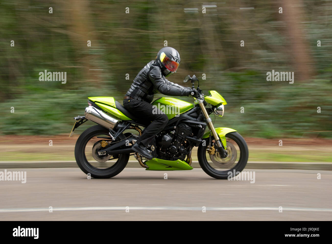 Triumph Street Triple Motorcycle on the road at speed Stock Photo - Alamy