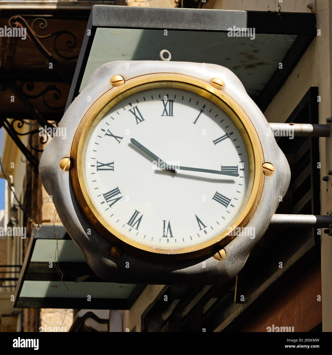 Street clock on building wall Stock Photo - Alamy
