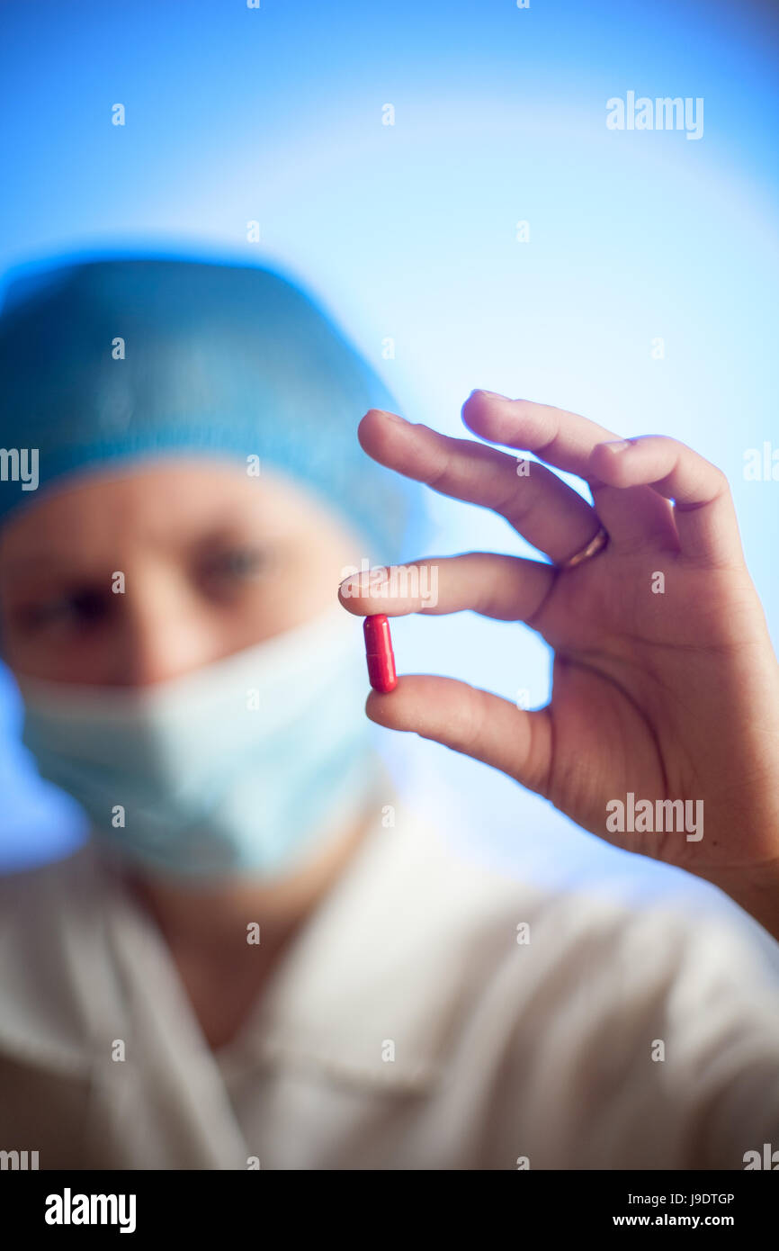 Nurse with pills in hand in hospital Stock Photo - Alamy