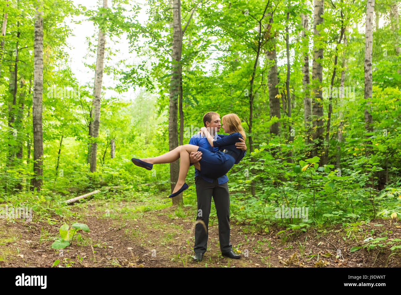 Romantic young couple in love relaxing outdoors in park Stock Photo - Alamy