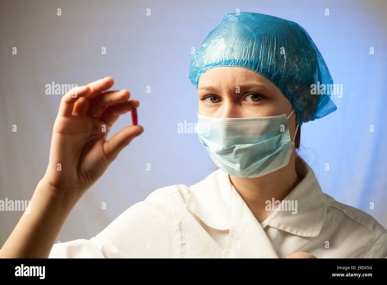 Nurse with pills in hand in hospital Stock Photo - Alamy