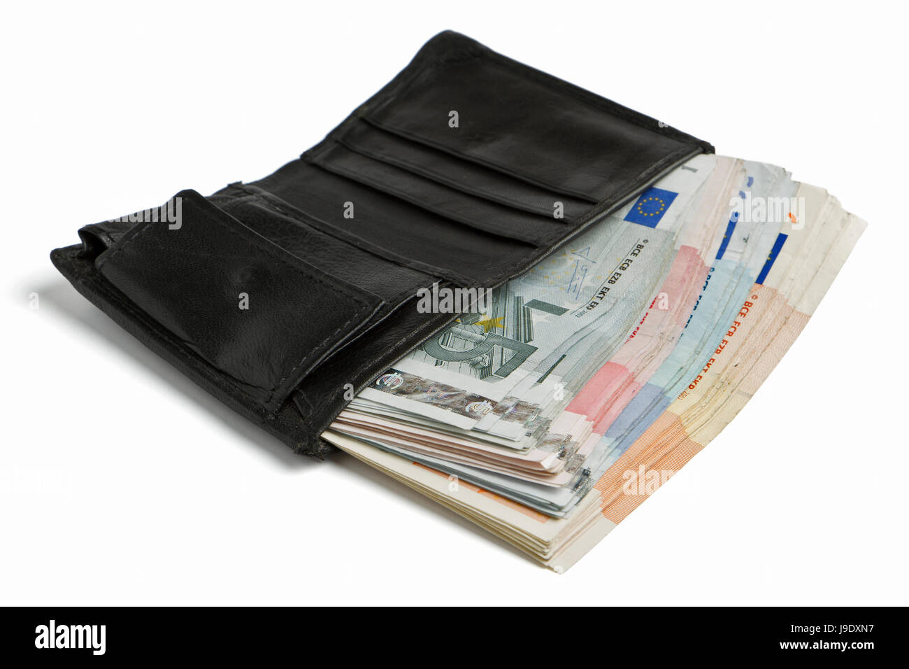 many banknotes in black wallet on light background Stock Photo - Alamy