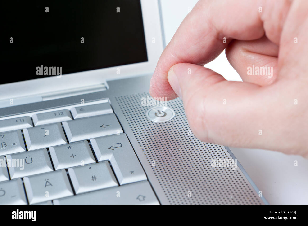 turning on a notebook Stock Photo - Alamy