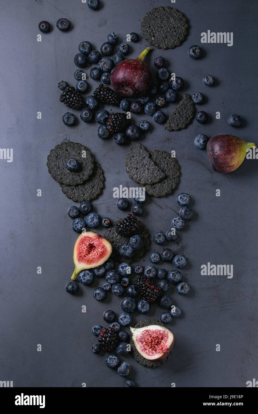 Variety of berries and figs with black crackers Stock Photo - Alamy