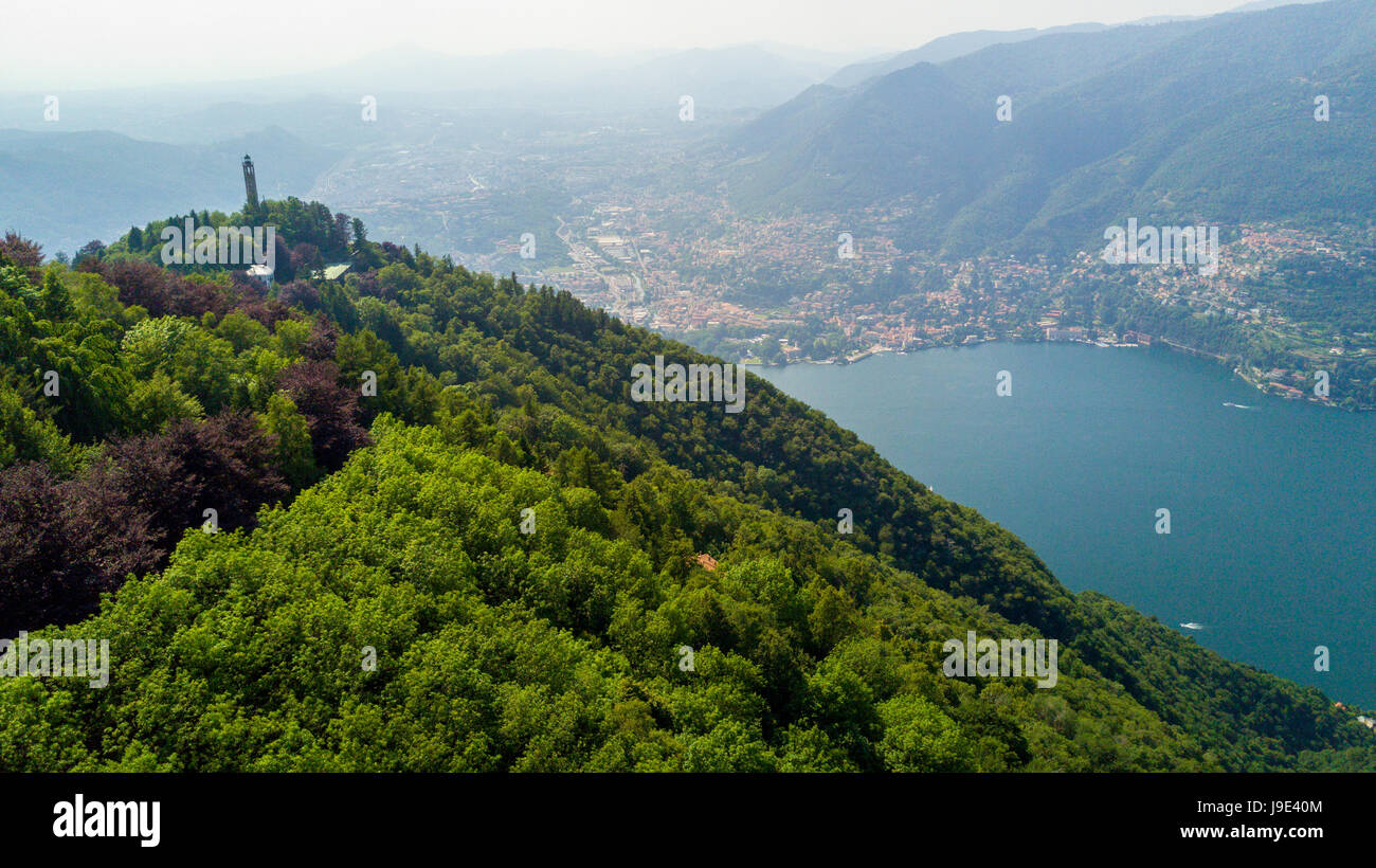 Aerial view of the Voltiano Lighthouse of Brunate and Como lake, trees ...