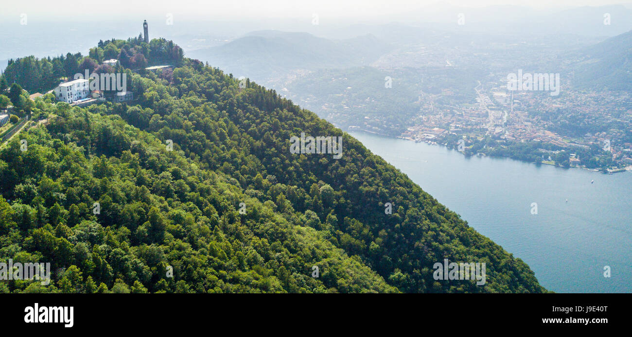 Aerial view of the Voltiano Lighthouse of Brunate and Como lake, trees ...