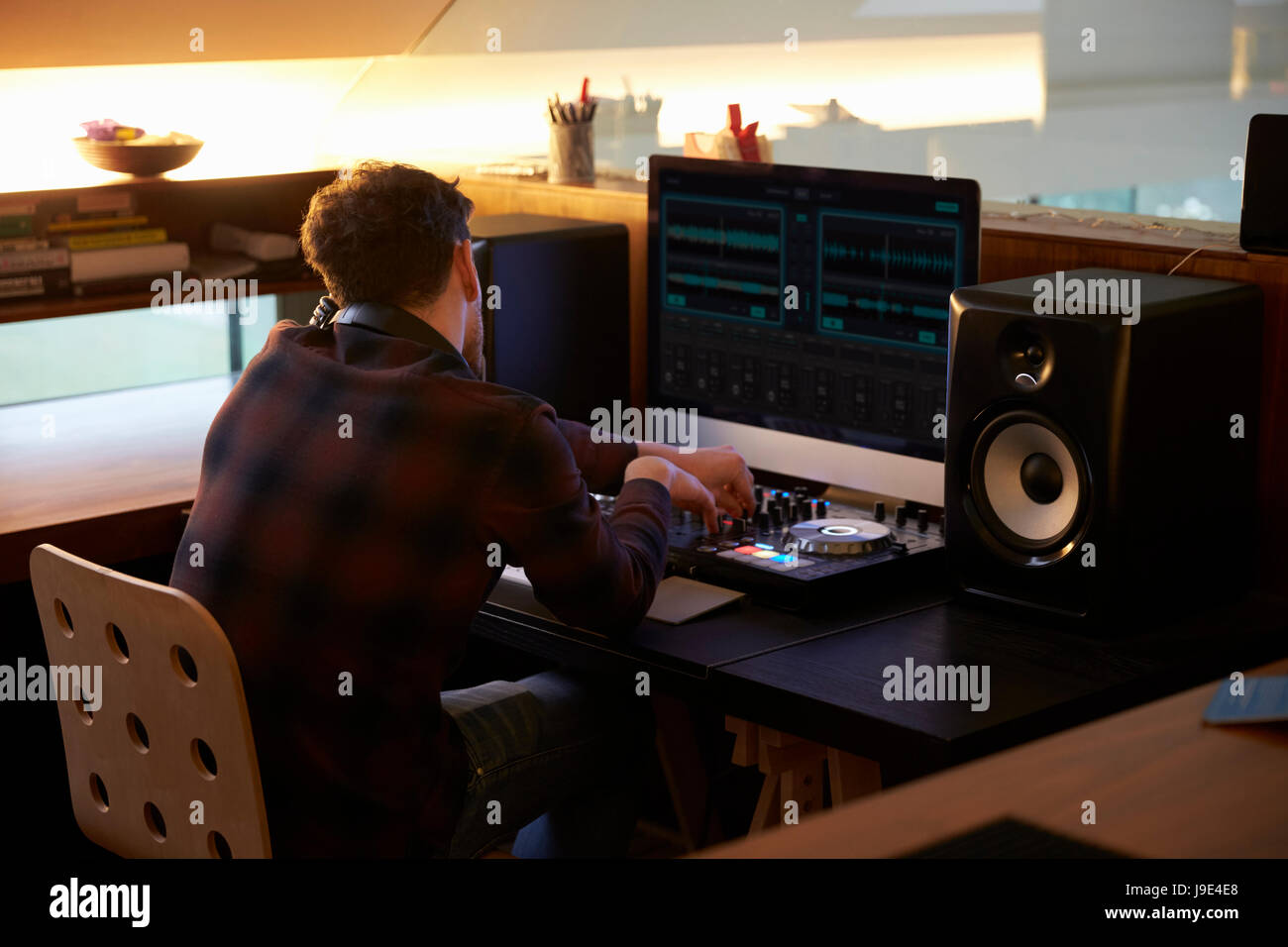 Man Composing Music on Computer in Bedroom Stock Photo - Alamy
