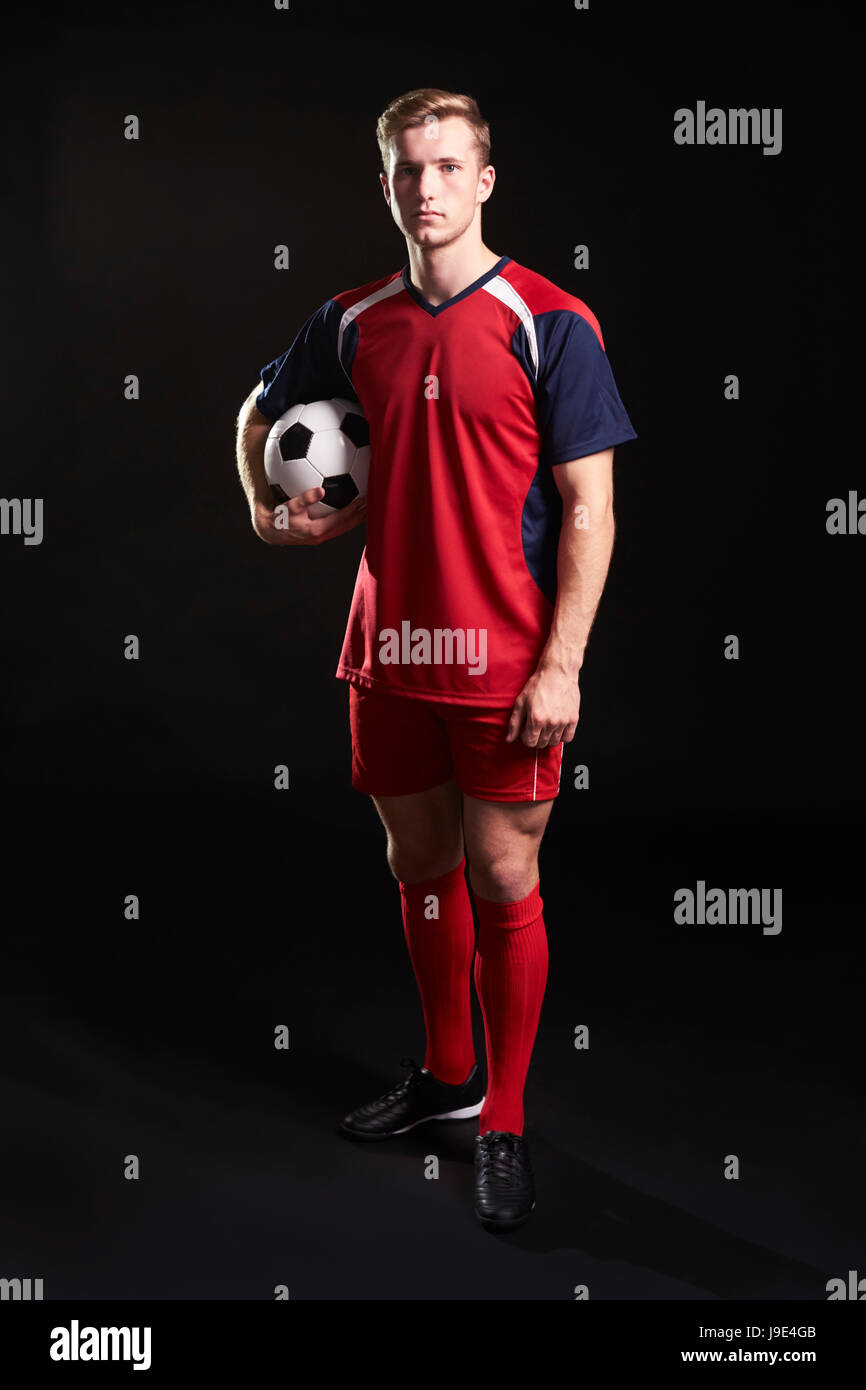 Portrait Of Professional Soccer Player With Ball In Studio Stock Photo ...