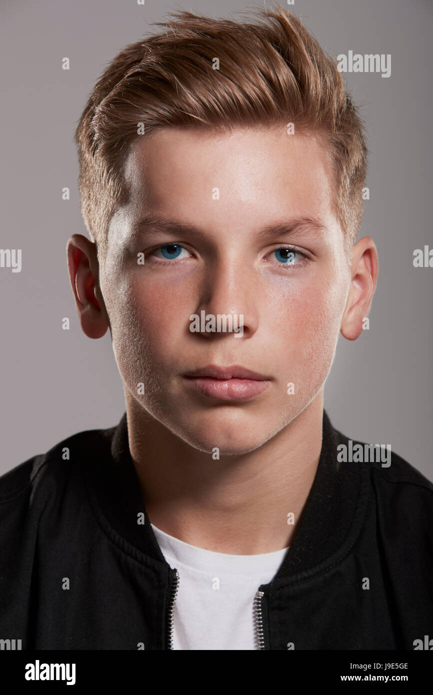 White teenage boy looking to camera, portrait, vertical Stock Photo - Alamy