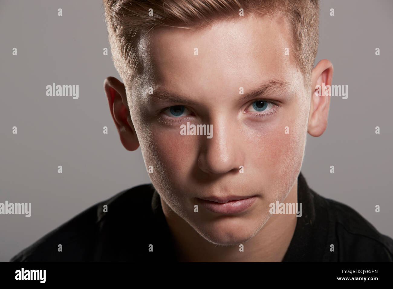White teenage boy looking up to camera, close up Stock Photo - Alamy