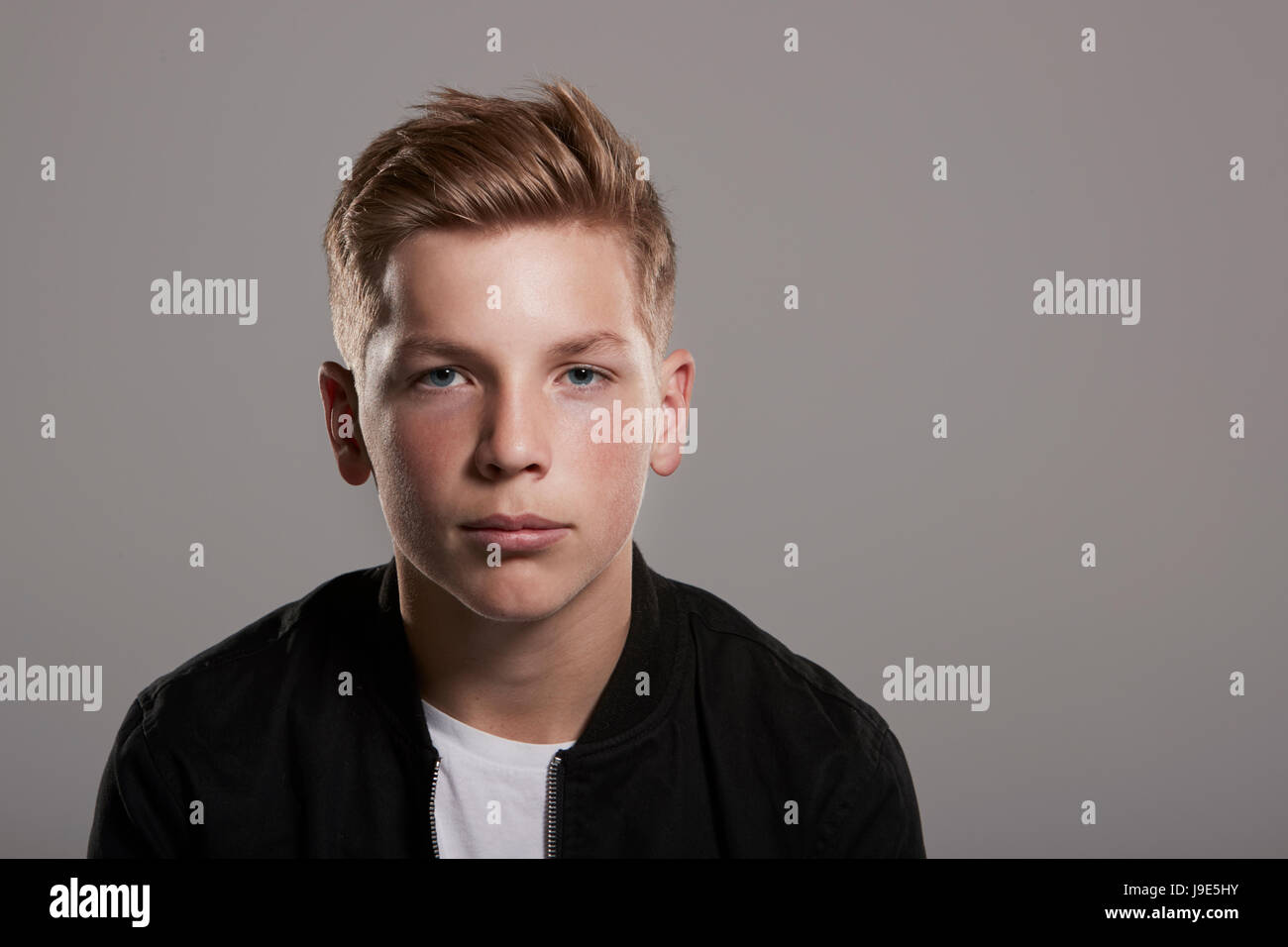 White teenage boy looking to camera, portrait,front view, horizontal ...