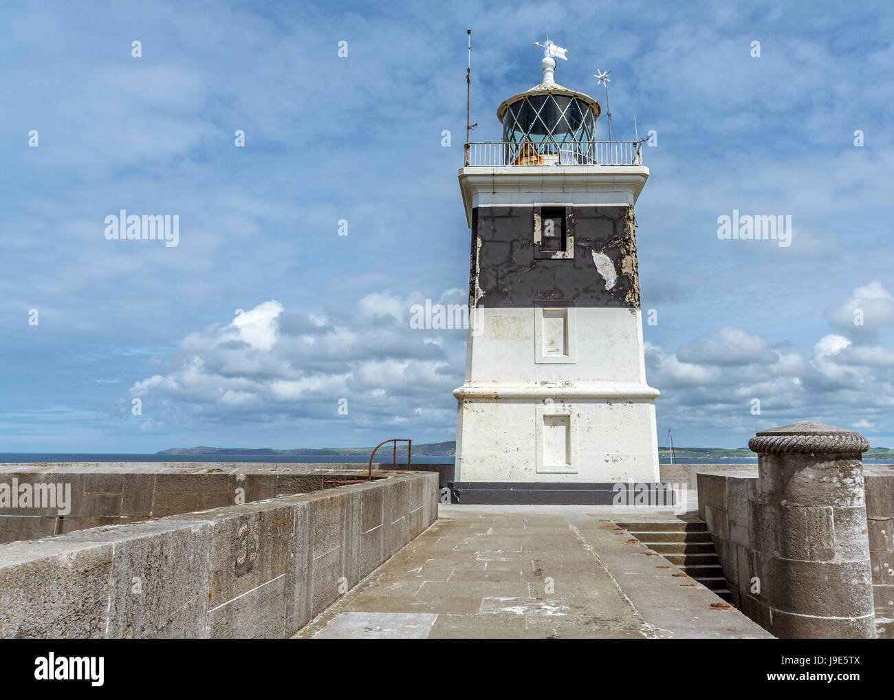 View of the lighthouse at the end of Holyhead breakwater on Anglesey ...
