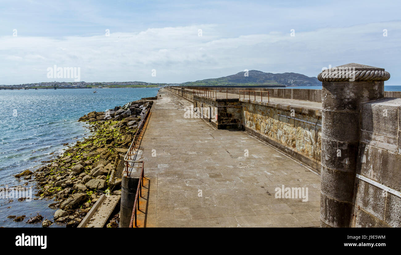 A view along the Holyhead breakwater on Anglesey towards Holyhead ...