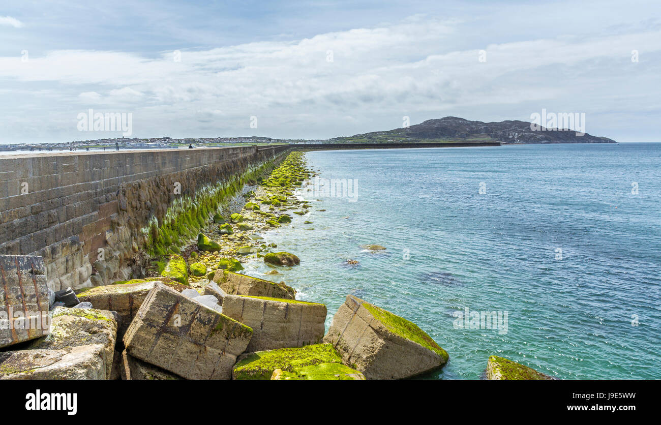 A view along the Holyhead breakwater on Anglesey towards Holyhead ...