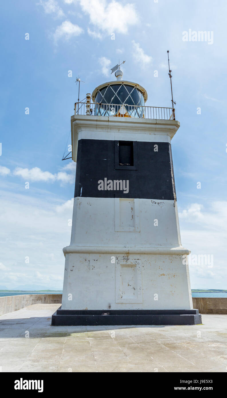 View of the lighthouse at the end of Holyhead breakwater on Anglesey ...