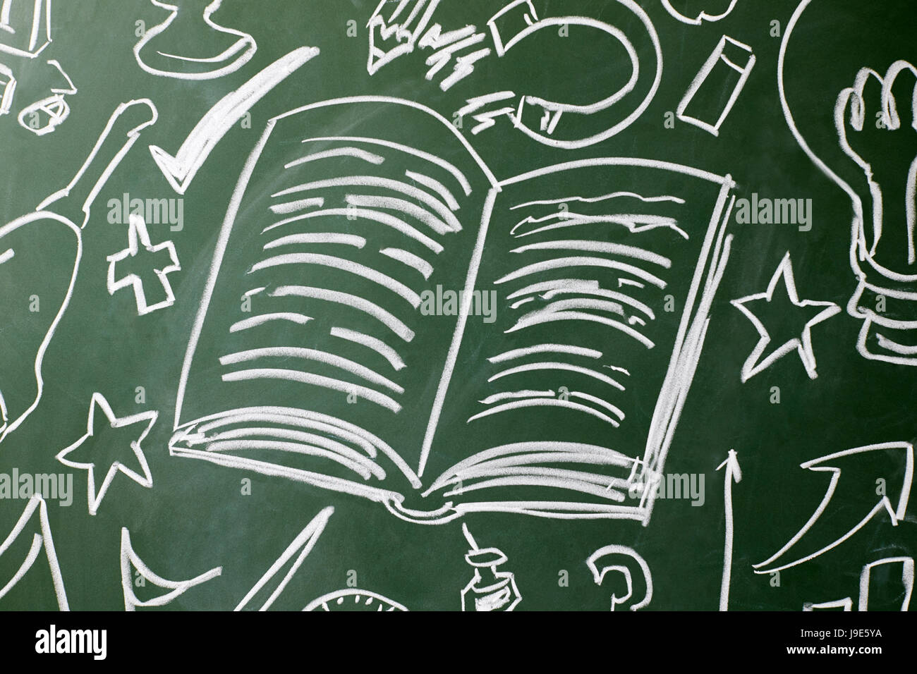 Open book and symbols drawn on a chalkboard, copy space Stock Photo - Alamy