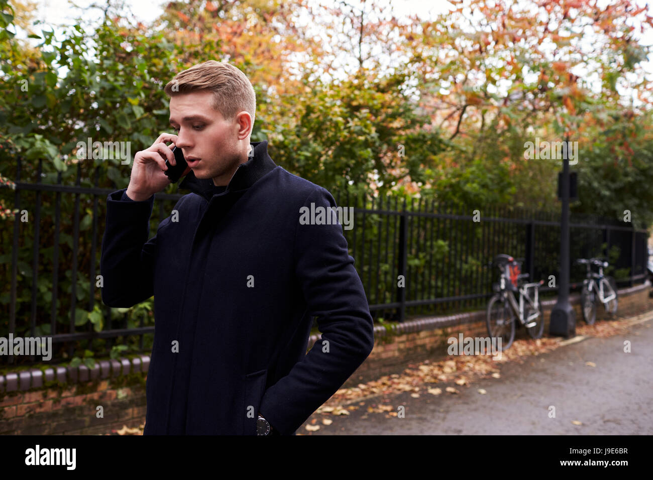Young Man Talking On Mobile Phone In Oxford Street Stock Photo - Alamy
