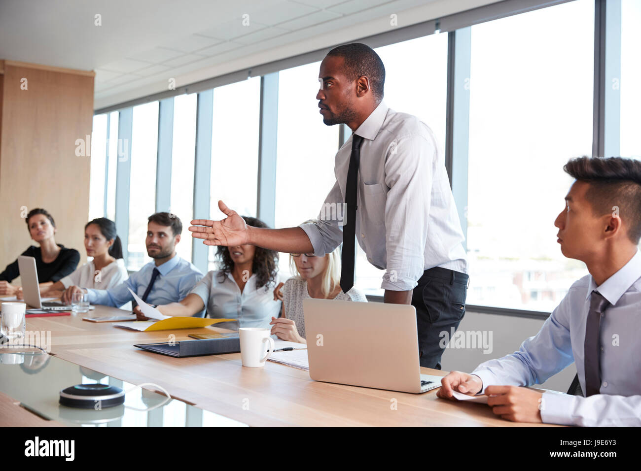 Mature businessman addressing group hi-res stock photography and images ...