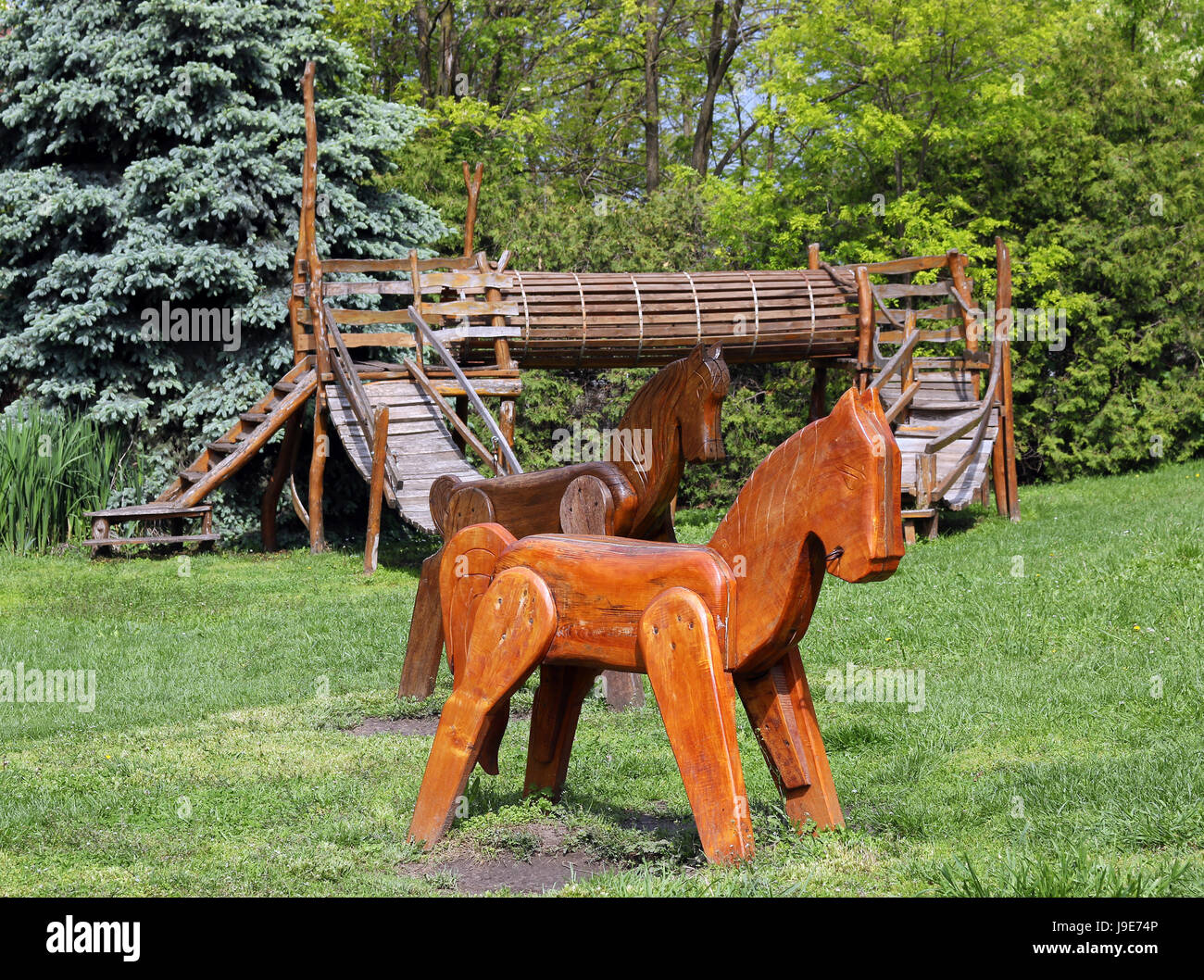 playground with wooden horses Stock Photo - Alamy