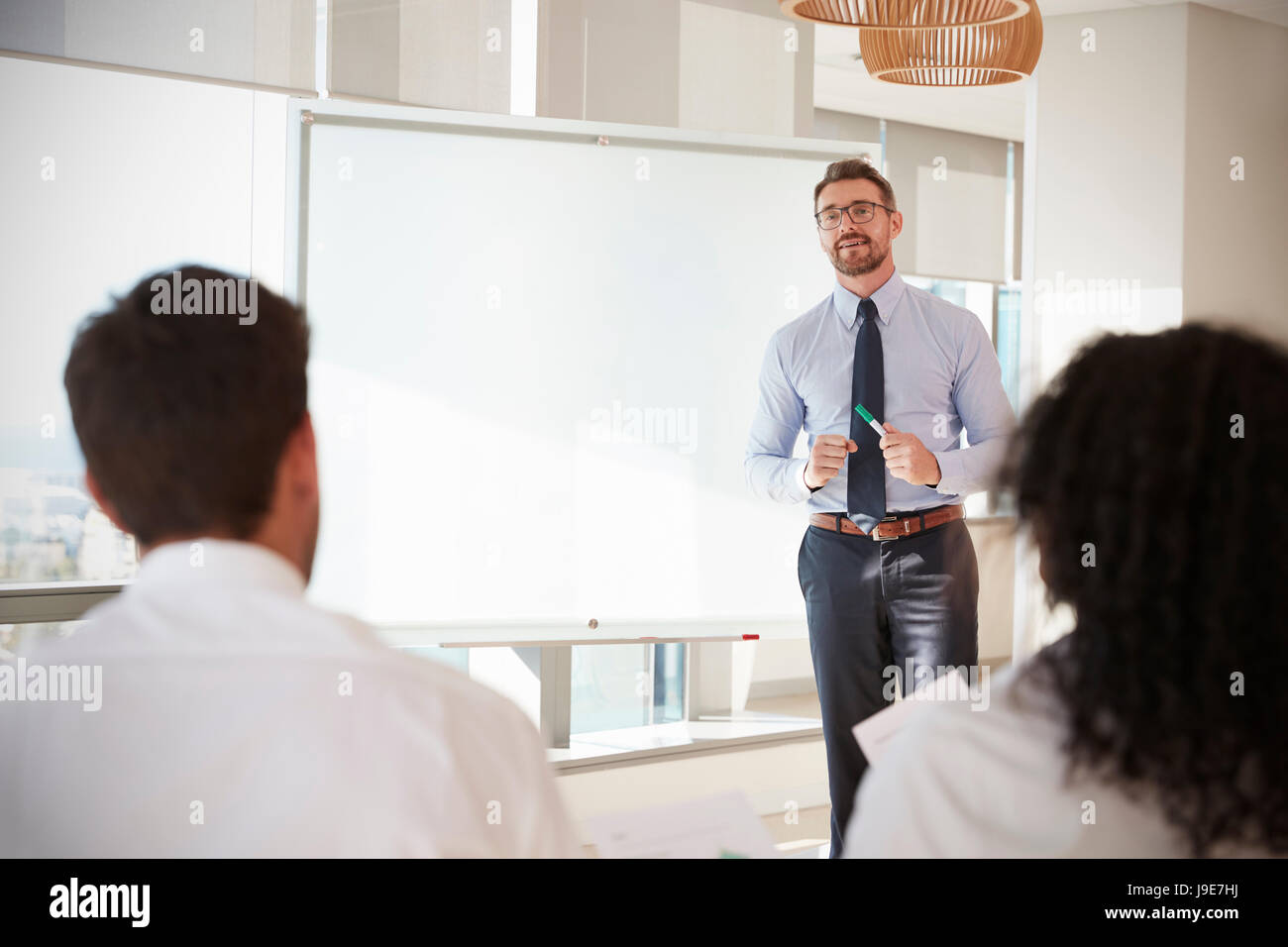 Person making presentation whiteboard hi-res stock photography and ...