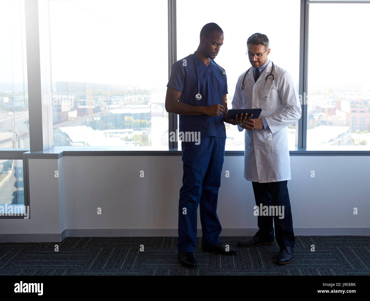 Doctor nurse review tablet hi-res stock photography and images - Alamy