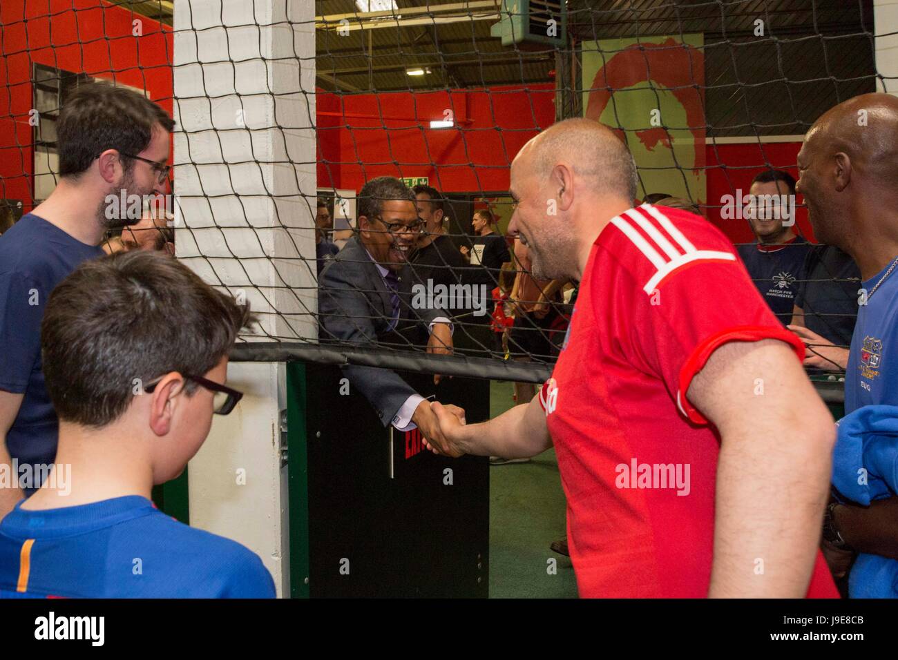 Jason Mohammad shakes hands with Vaughan Gething AM ahead of the Match ...
