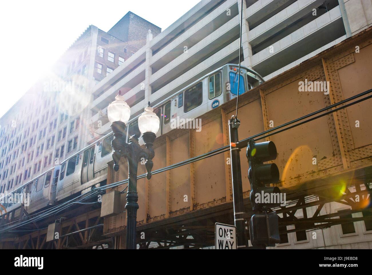 Loop train riding above a street in Chicago Stock Photo - Alamy