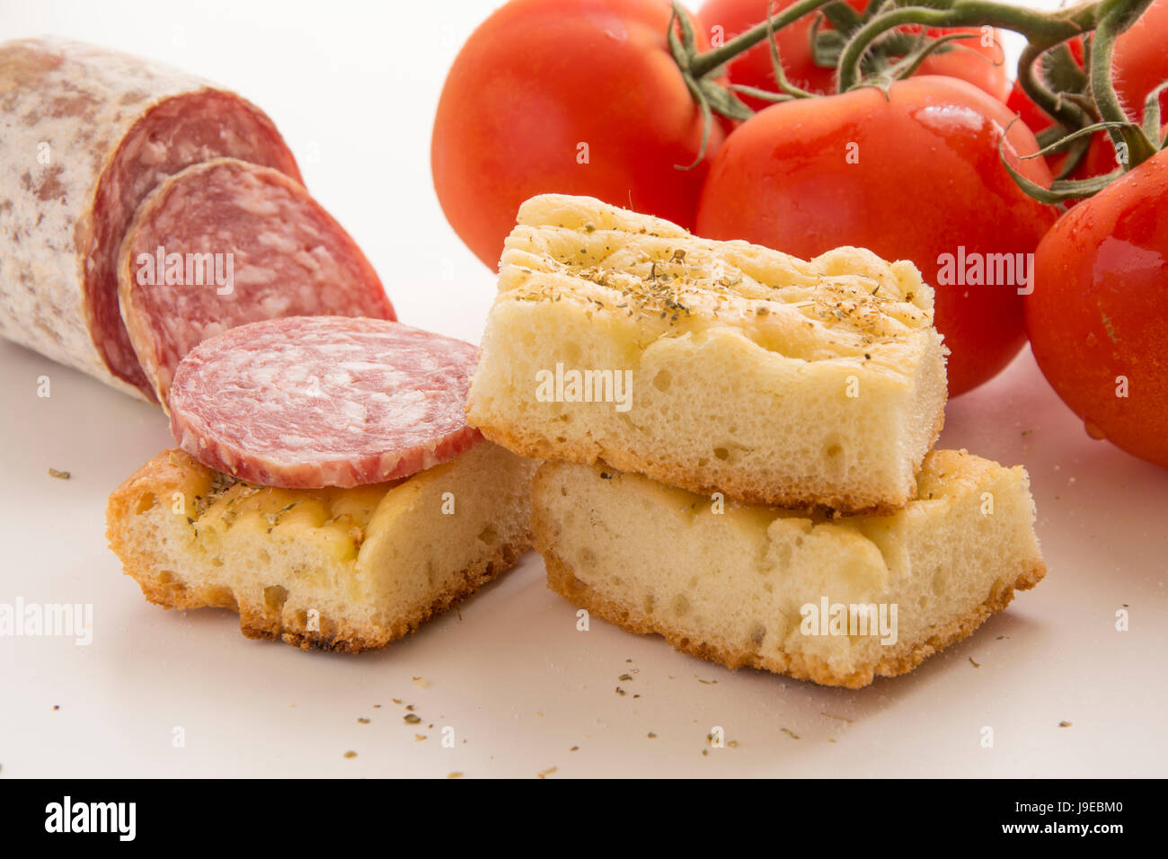 Italian rustic appetizer, tasty focaccia, salami tomatoes Stock Photo ...