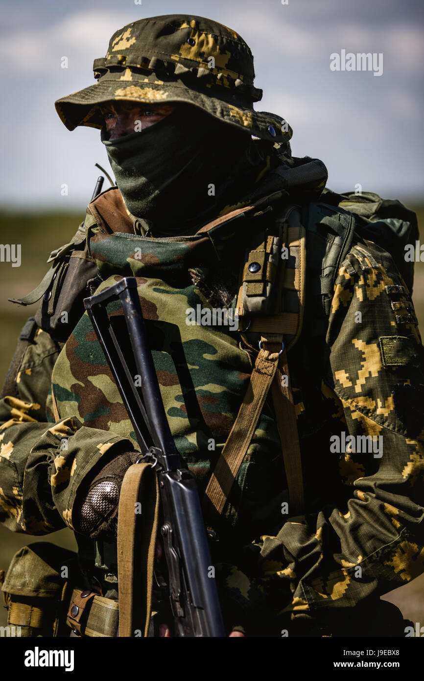 Photo of man with gun Stock Photo - Alamy