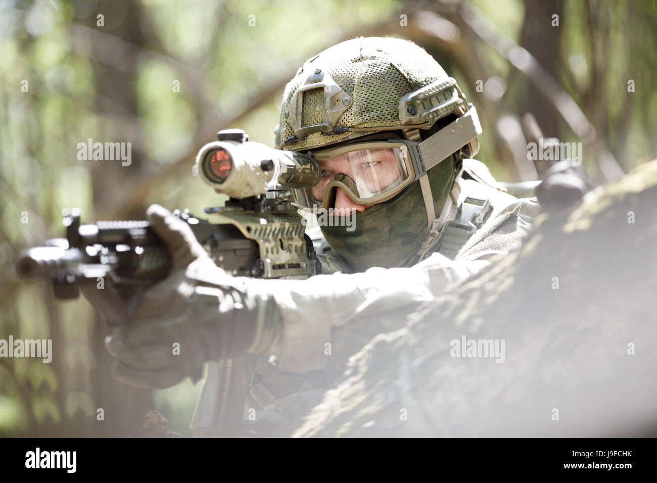 Soldier with airsoft automatic rifle Stock Photo - Alamy