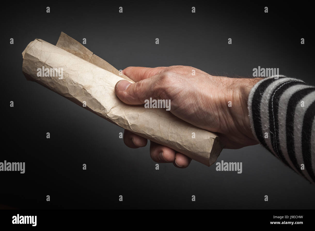 Old man holding sheet of paper hi-res stock photography and images - Alamy