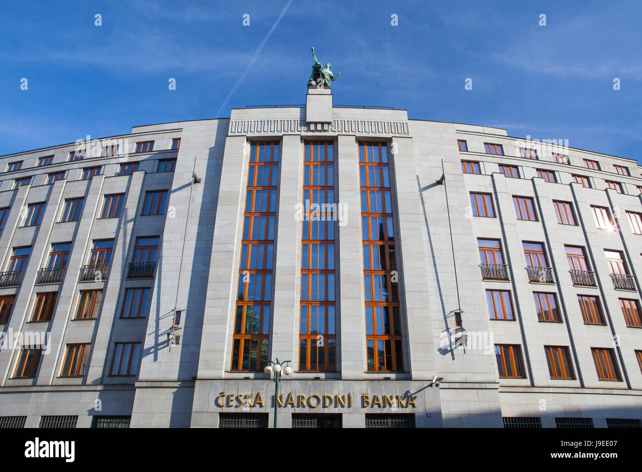 Prague, Czech Republic - May 10, 2017: Statue on roof of entrance to ...
