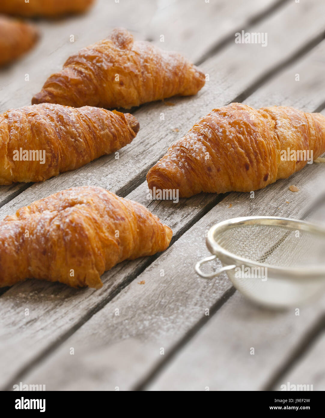 French crescent-shaped roll made of sweet flaky yeast dough- croissant ...