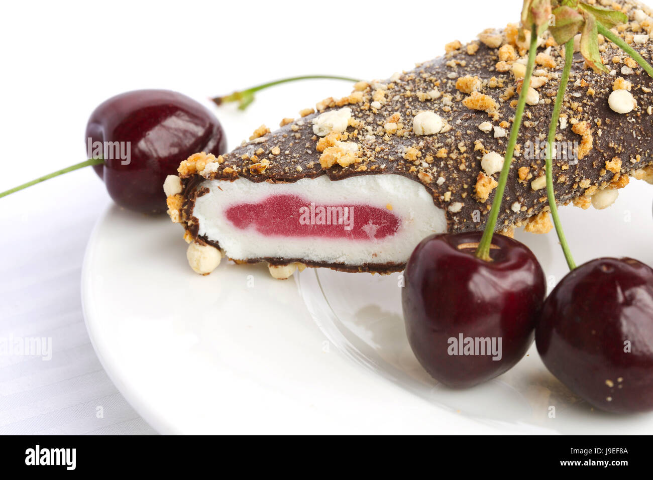 Eskimo vanilla ice cream with chocolate and black cherries Stock Photo ...