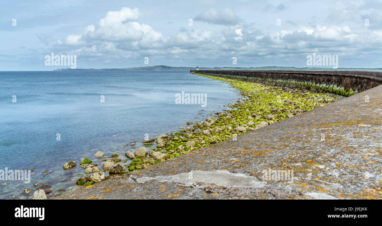 Perspective view along the breakwater at Holyhead on Anglesey Stock ...