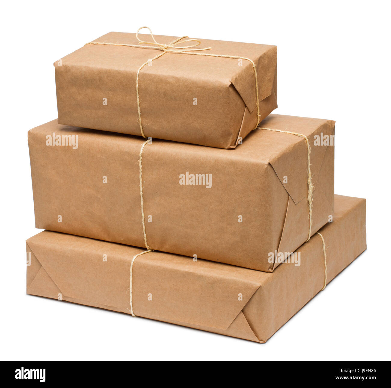 Stack of parcel wrapped in brown paper and tied with rough twine Stock ...