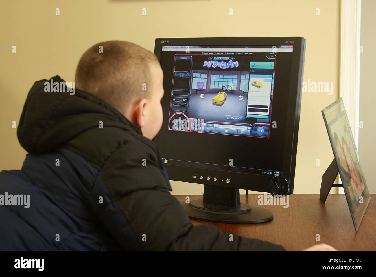 Little boy playing computer game Stock Photo - Alamy