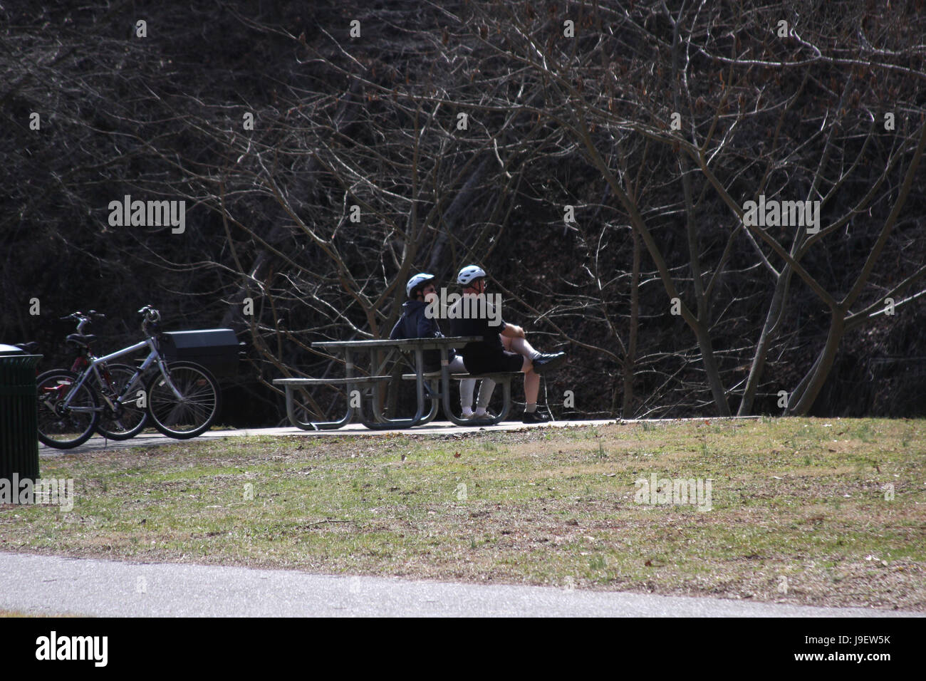 Resting on bench after bike ride Stock Photo - Alamy