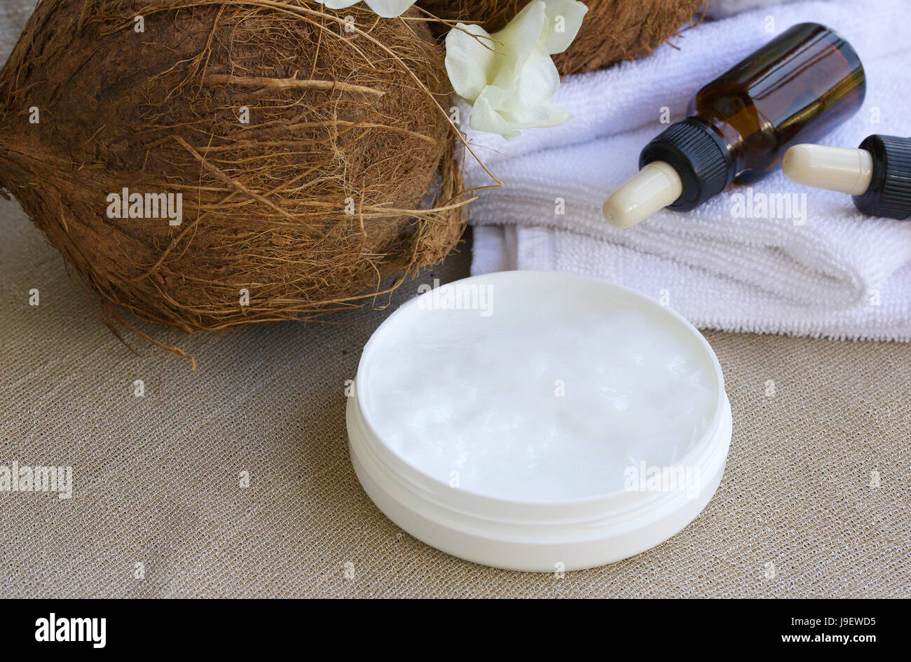 Coconut butter body cream. Coconuts,dropper bottles with coconut oil ...