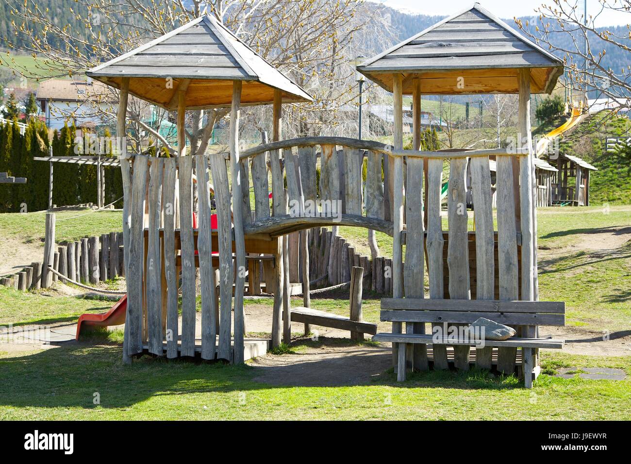 Wooden made playground slide complex for children Stock Photo - Alamy